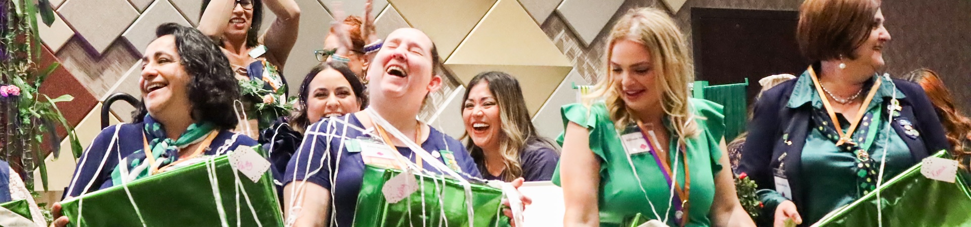 our ceo, a board member, and volunteer smiling for a picture